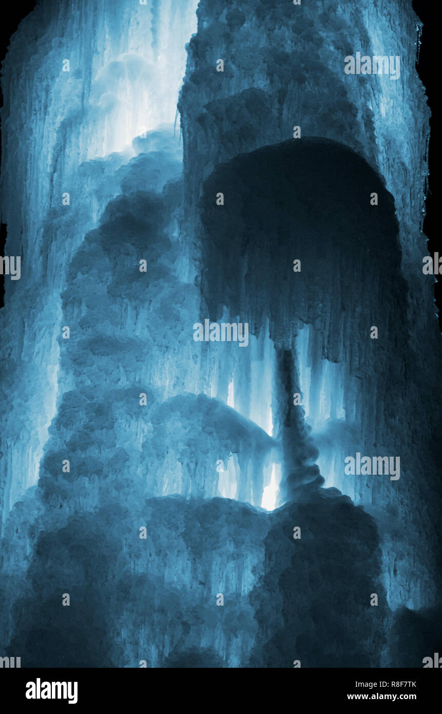 Huge ice icicles. Large blocks of ice frozen waterfall or water. Blue ...