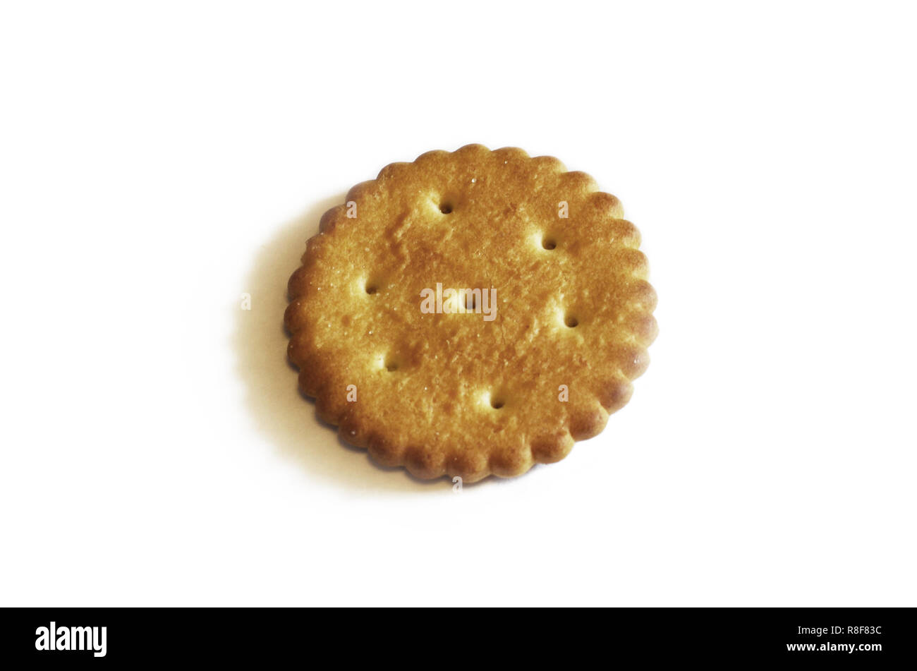 Classic round golden yellow salted cracker isolated on over white ...