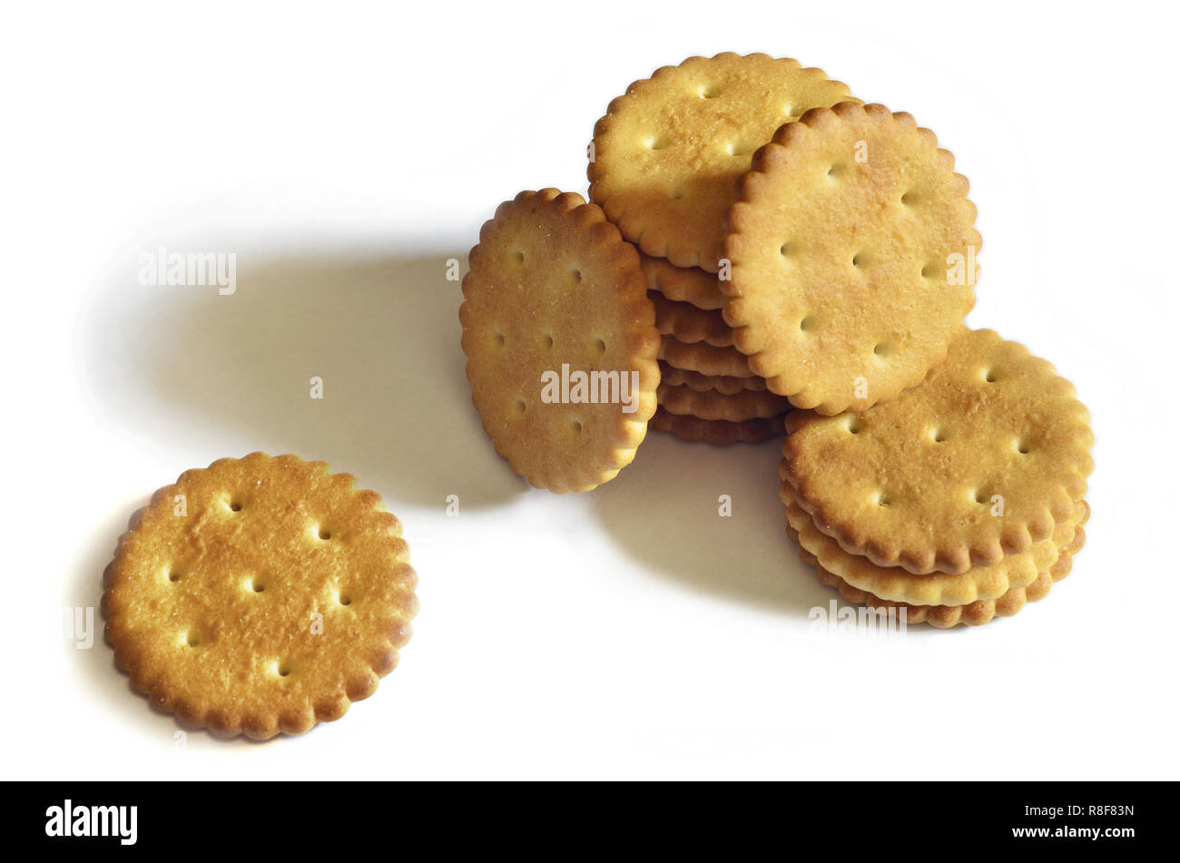 Classic round golden yellow salted cracker isolated on over white ...