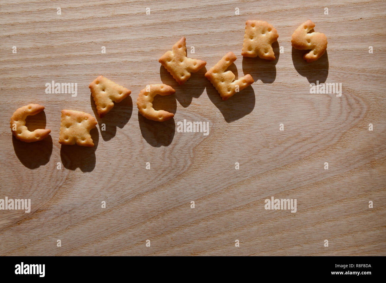 Crackers. Text from the salty crackers as printed English letters that ...