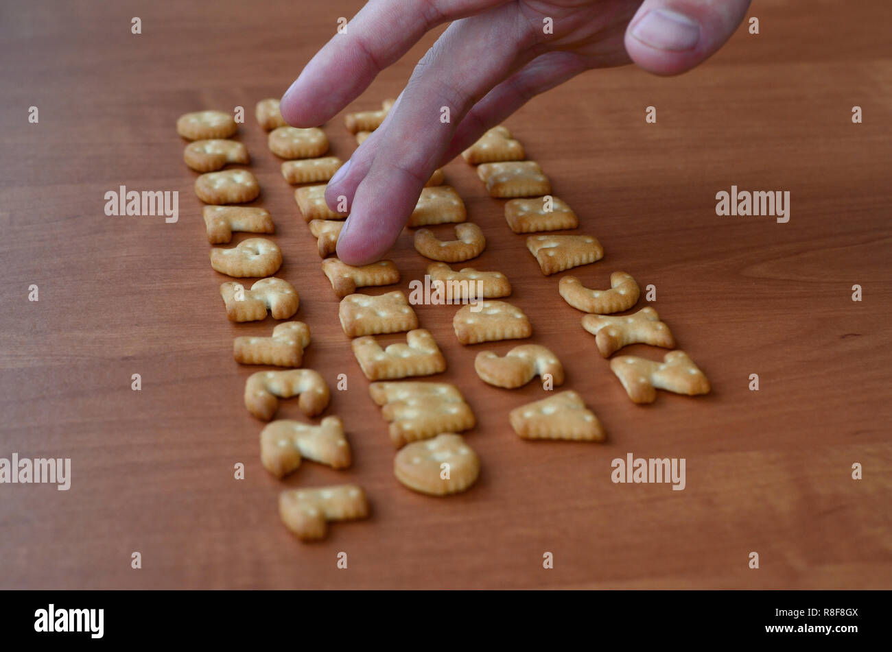 Men's fingers typing on the keyboard, which is composed of salty ...