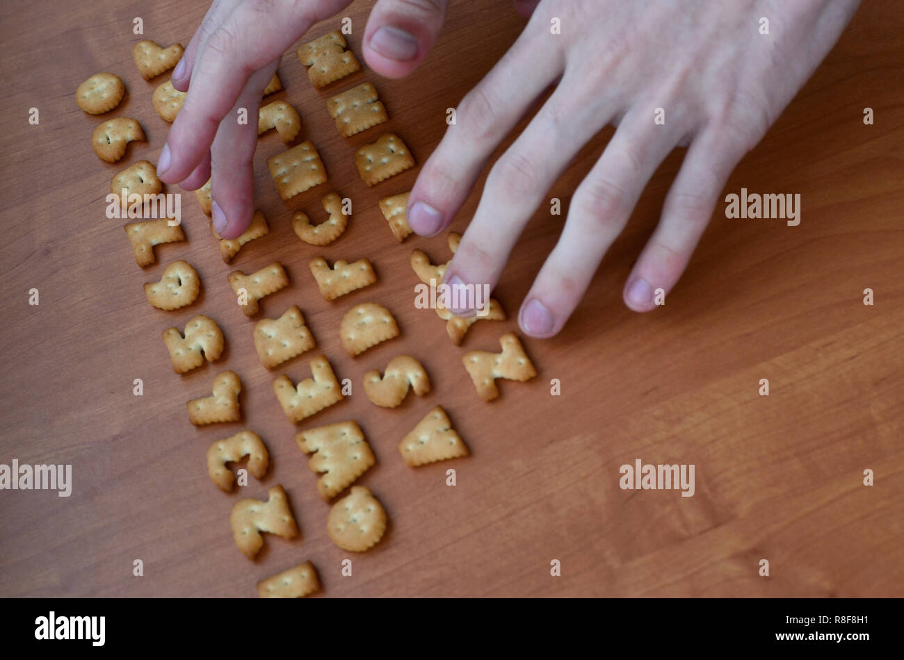Men's fingers typing on the keyboard, which is composed of salty ...