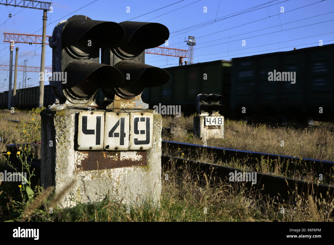 Railway landscape. Railroad sign (traffic light) with the railway ...