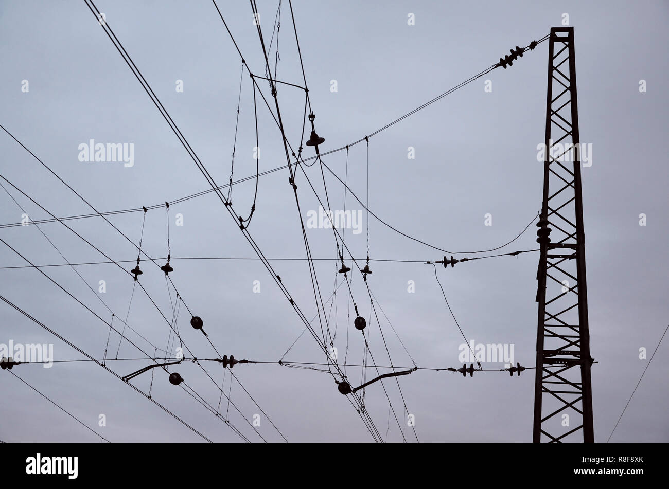Railroad overhead lines against clear blue sky, Contact wire. High ...