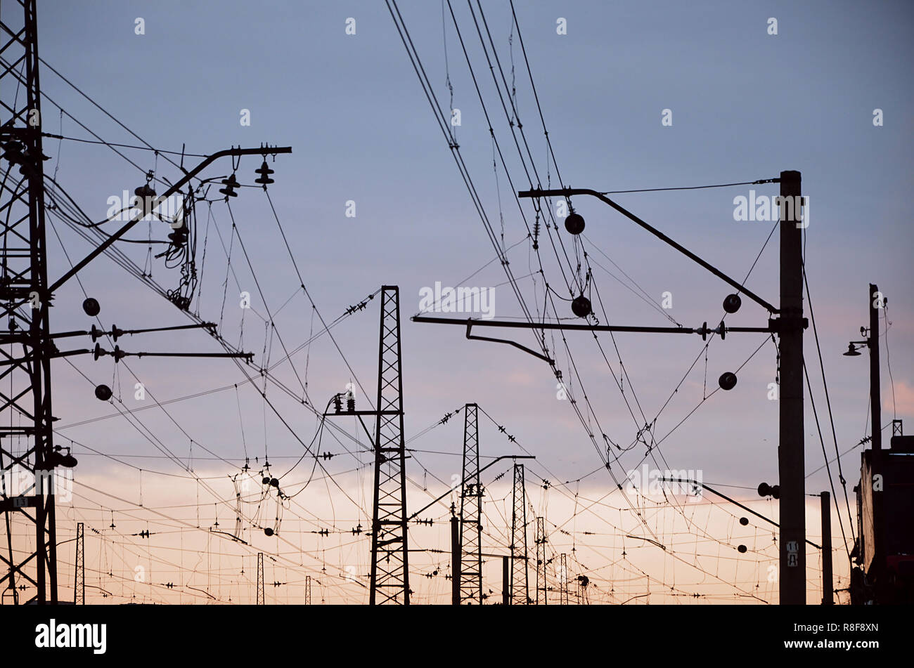 Railroad overhead lines against clear blue sky, Contact wire. High ...