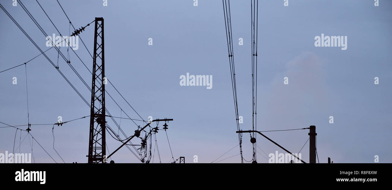 Railroad overhead lines against clear blue sky, Contact wire. High ...