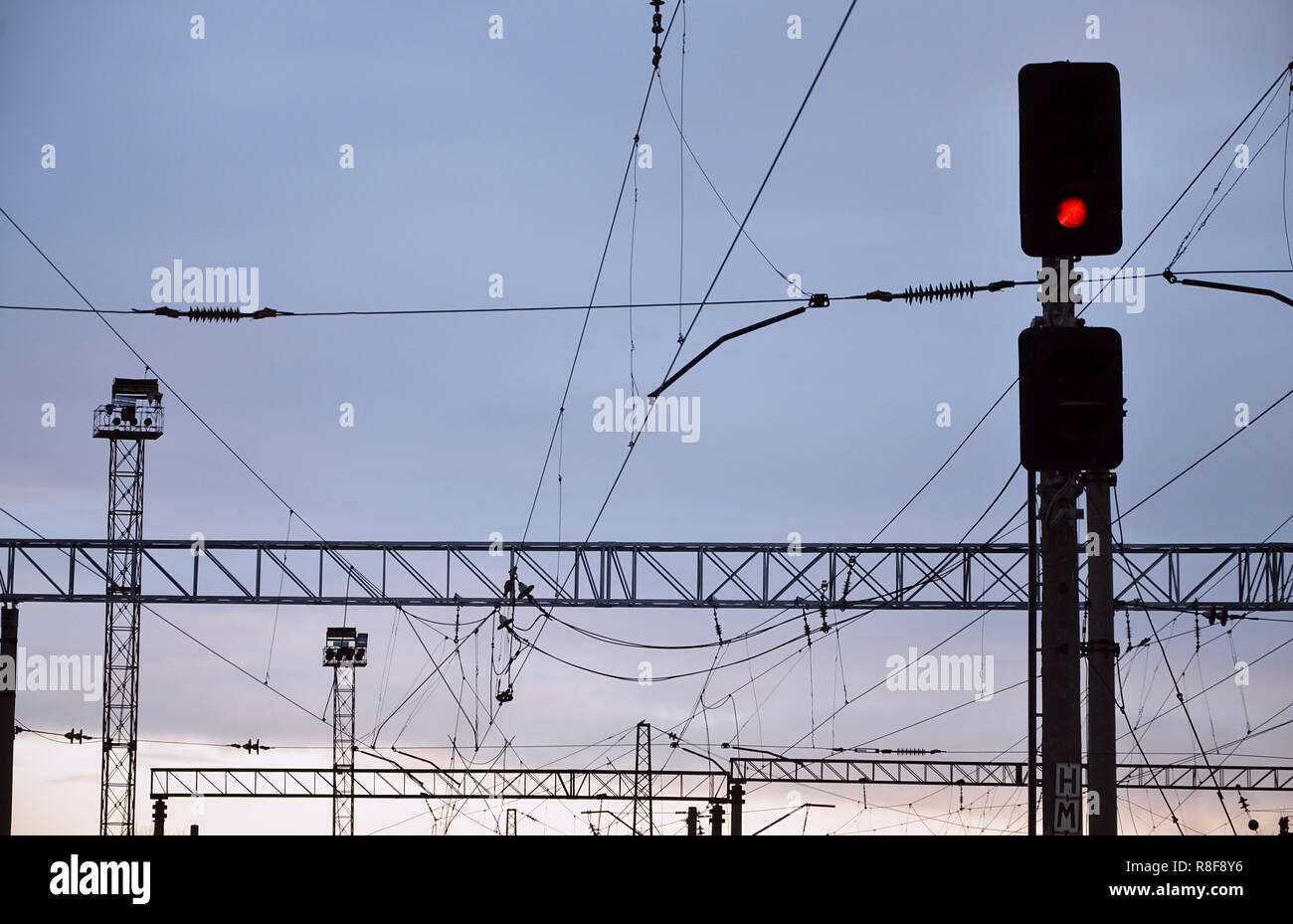 Railroad traffic light against clear blue sky, Contact wire. High ...