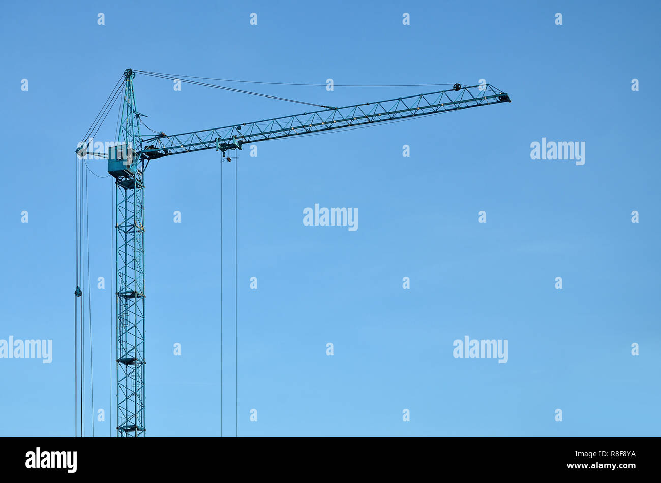 Abstract Industrial background with construction tower cranes over ...