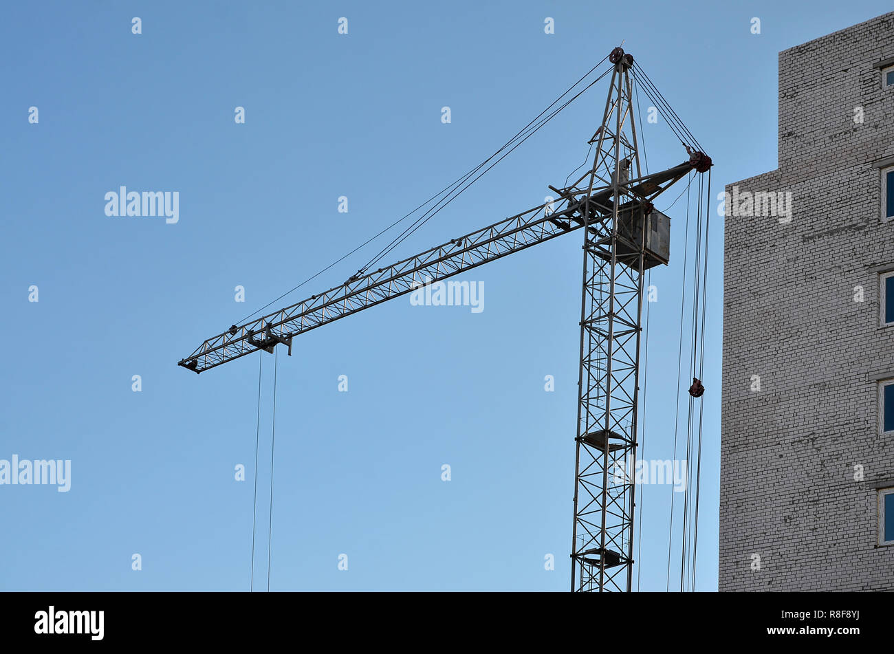 Working tall cranes inside place for with tall buildings under ...
