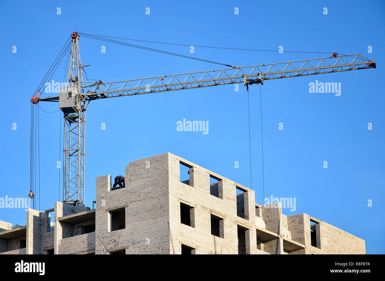 Working tall cranes inside place for with tall buildings under ...