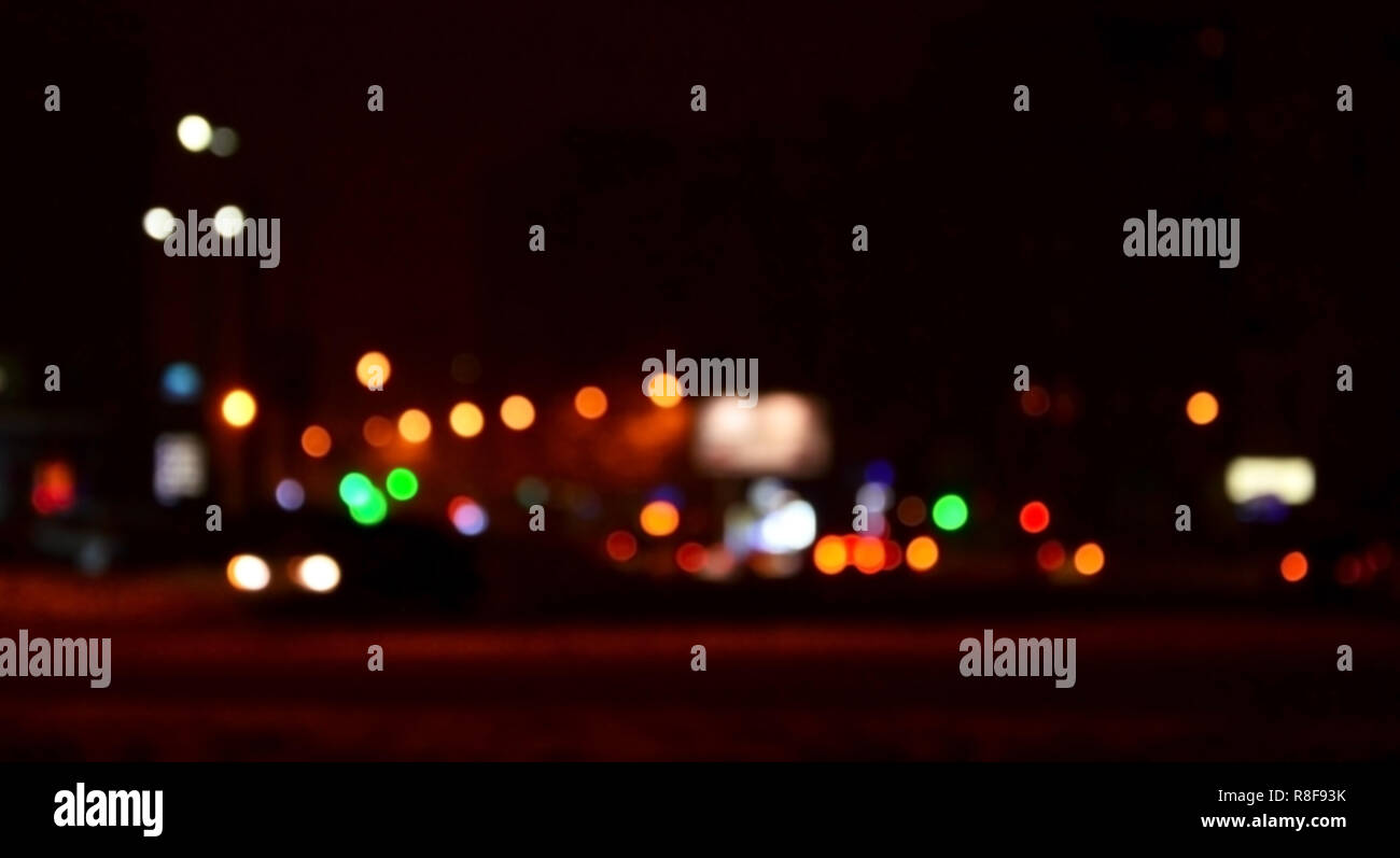Blurred Defocused Lights of Traffic on a Wet Rainy City Road at Night ...