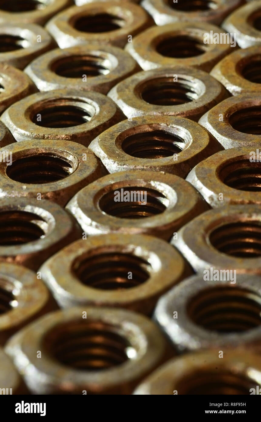 Closeup of a pile of rusty nuts. Retro industrial concept Stock Photo ...
