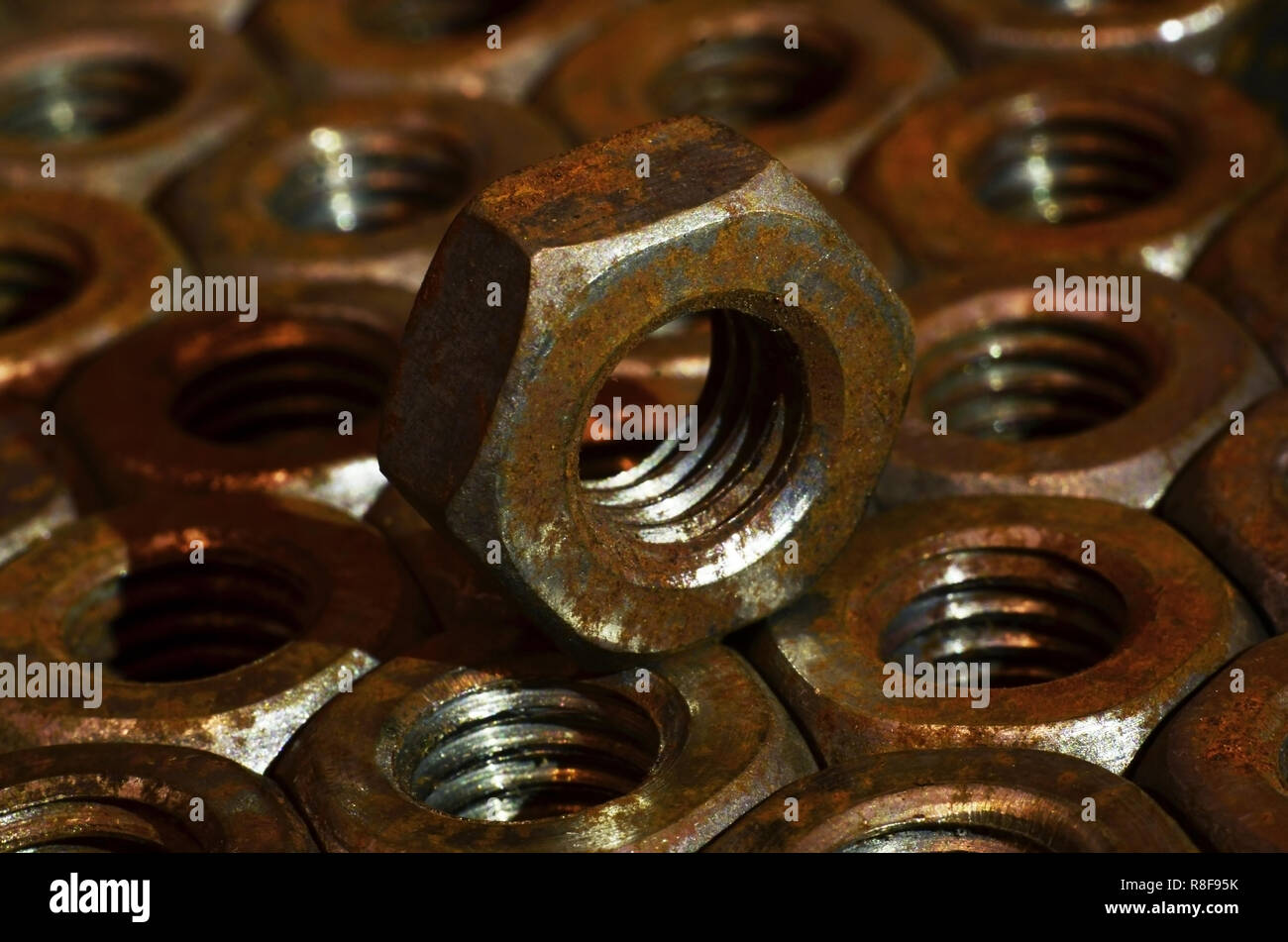 Closeup of a pile of rusty nuts. Retro industrial concept Stock Photo ...