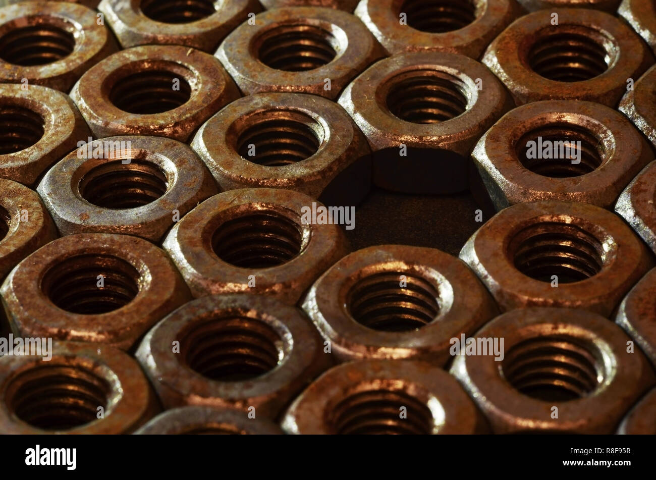 Closeup of a pile of rusty nuts. Retro industrial concept Stock Photo ...