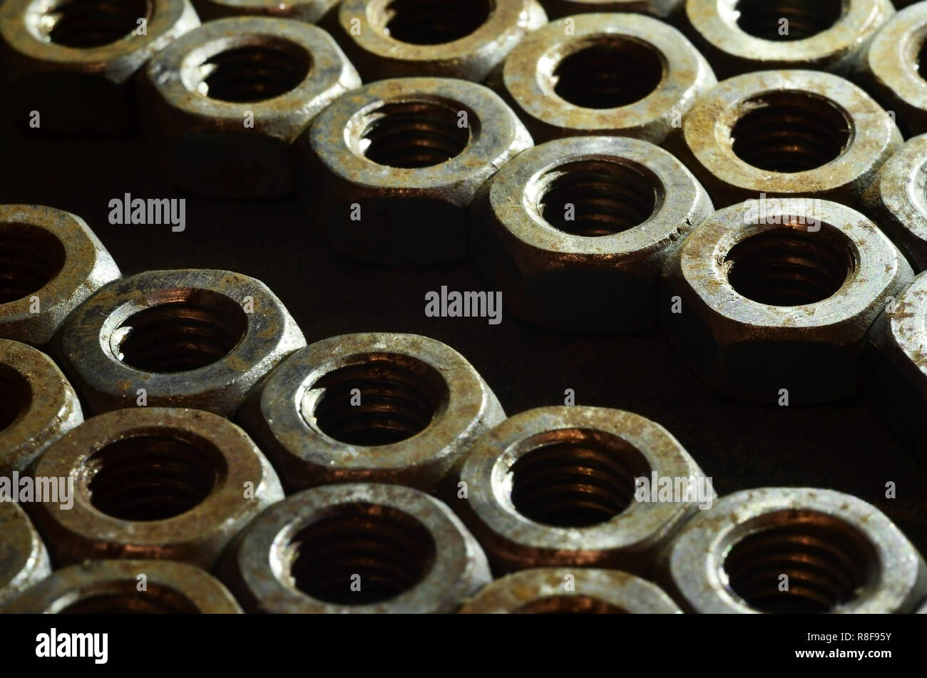 Closeup of a pile of rusty nuts. Retro industrial concept Stock Photo ...