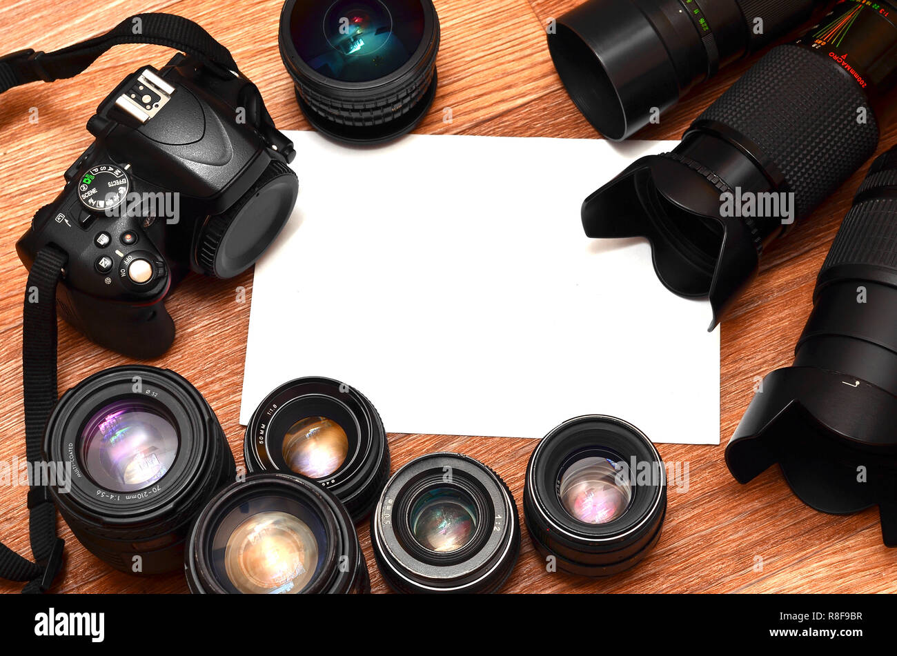 Complete kit for modern digital SLR camera and blank sheet of paper for ...