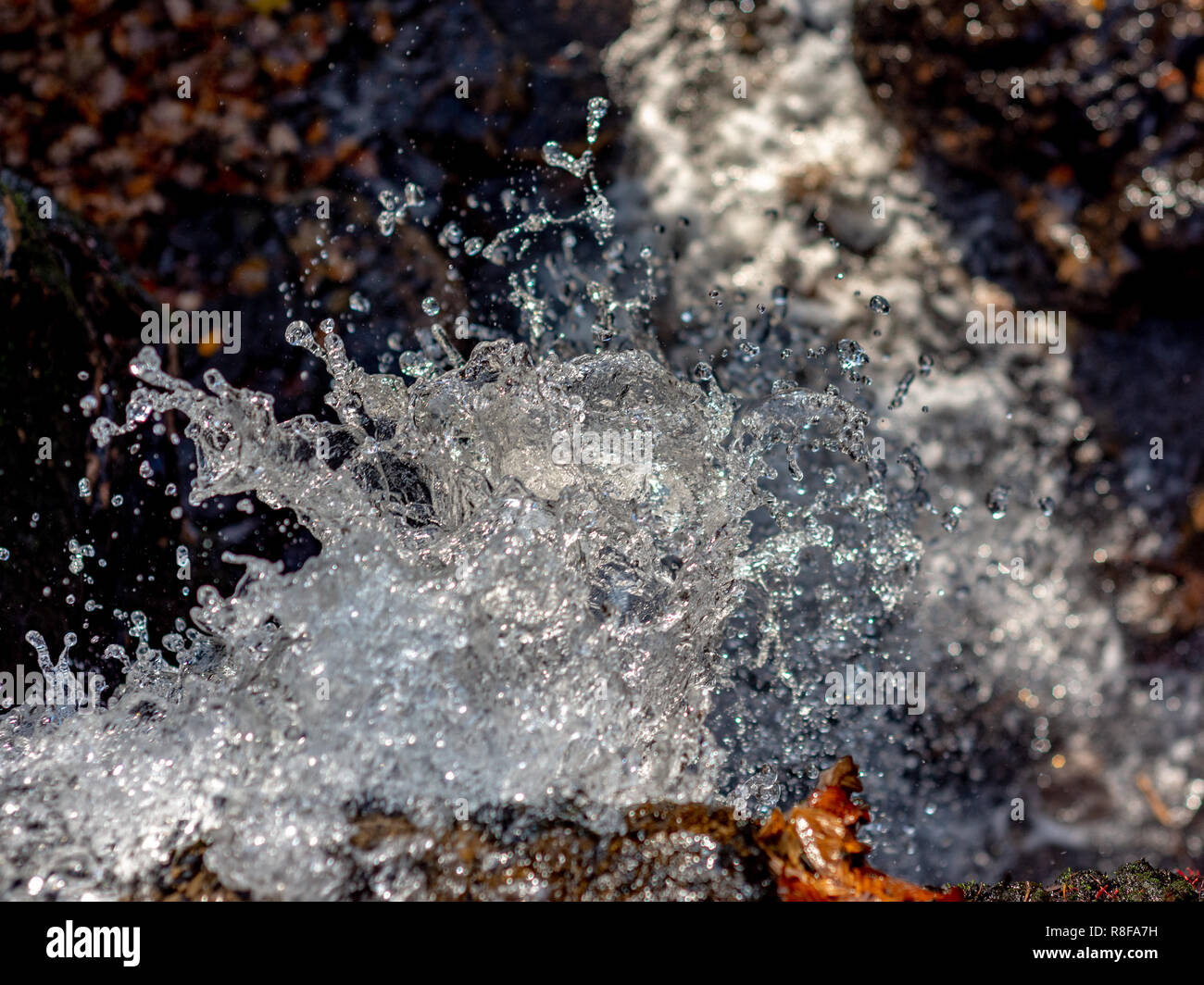 Water splashing over the top of a waterfall Stock Photo - Alamy