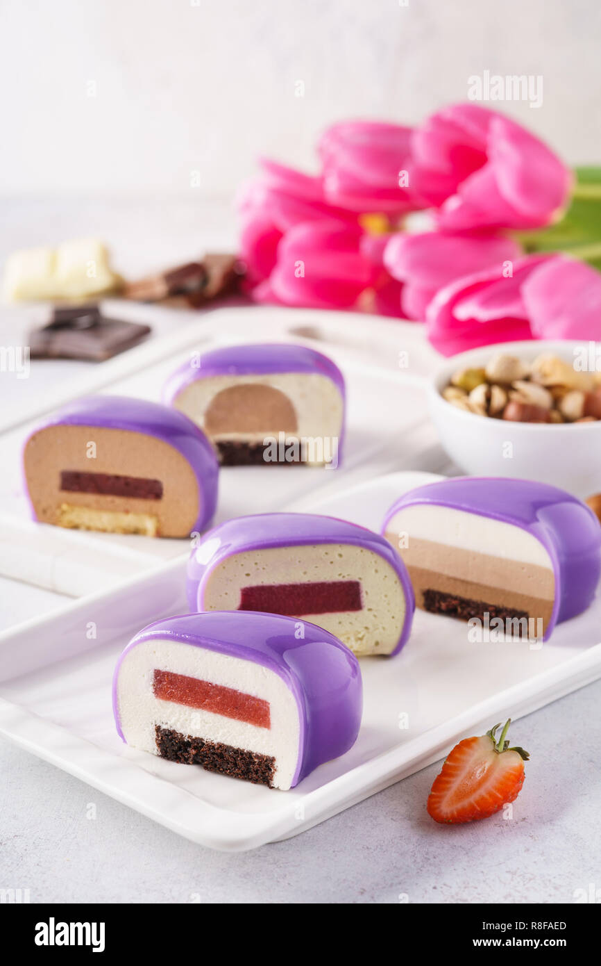 Set of mousse cakes with various chocolate and berry fillings Stock ...