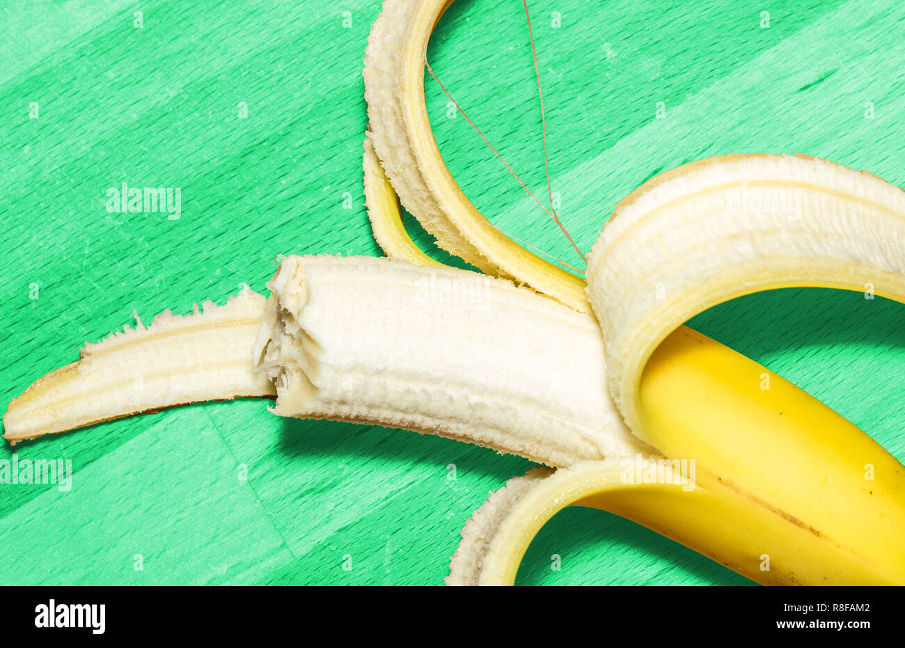 Banana, juicy tropical fruit isolated on green wooden background Stock ...