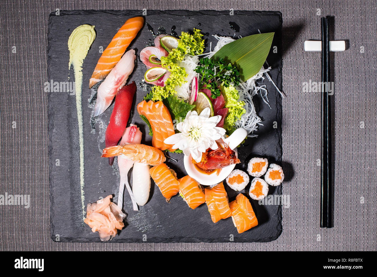 Mix of different japanese traditional food, sushi and sashimi served on ...