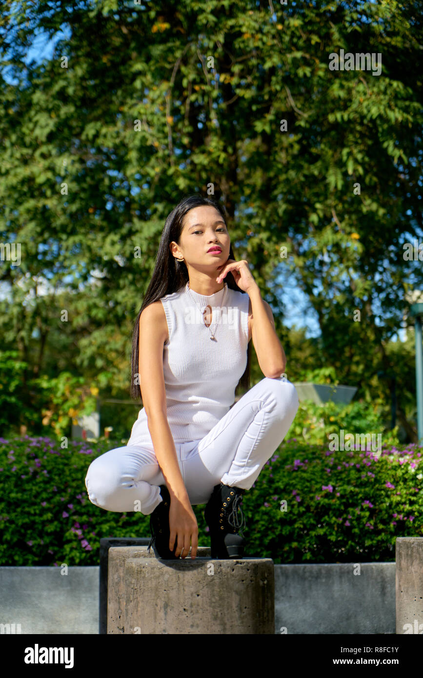 Beautiful woman posing - sitting, thinking and blank expression Stock ...