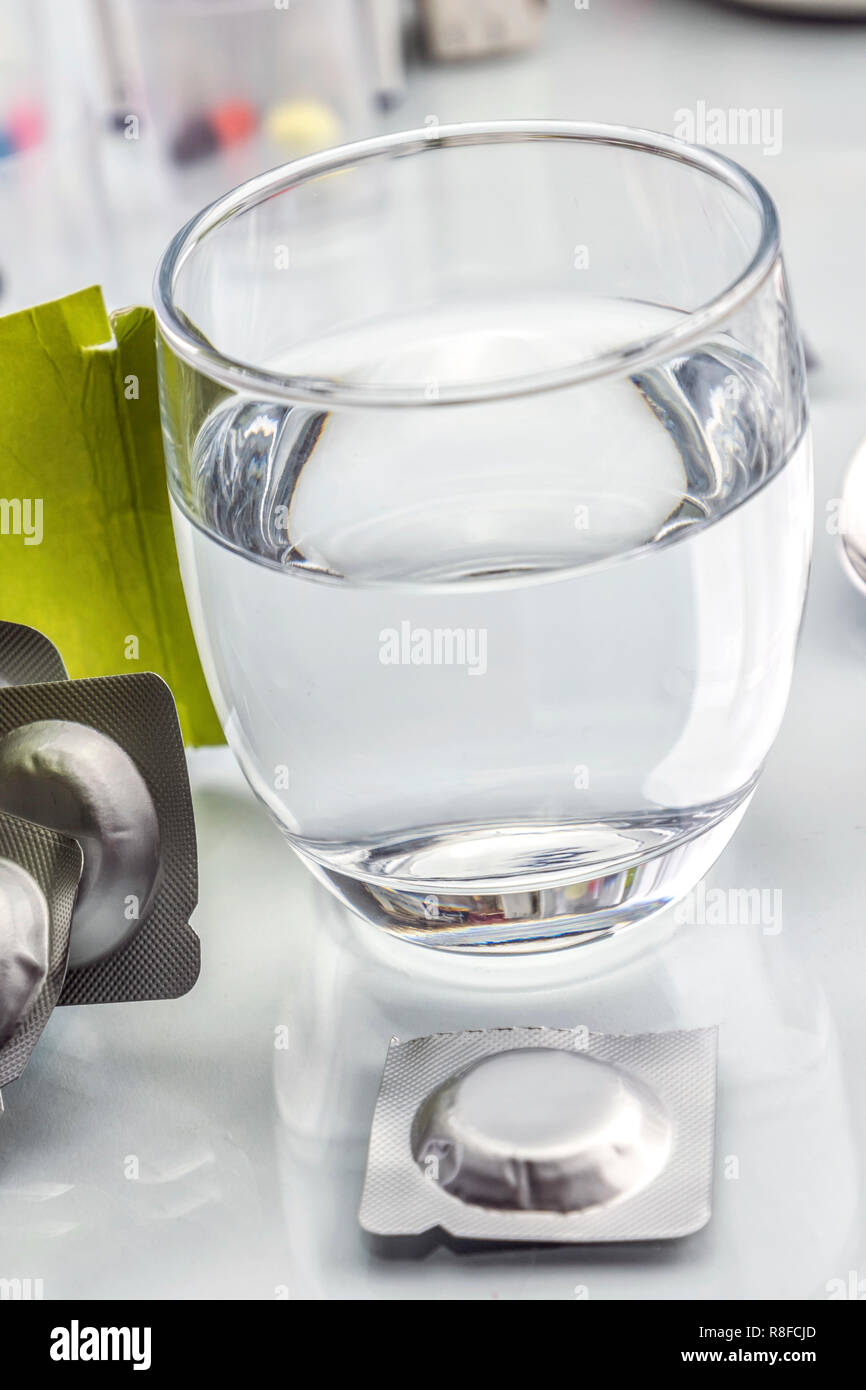 effervescent tablets and glass with water, conceptual image Stock Photo ...