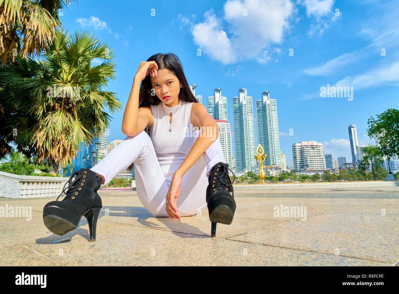 Beautiful woman posing - sitting, tired, mad and serious Stock Photo ...