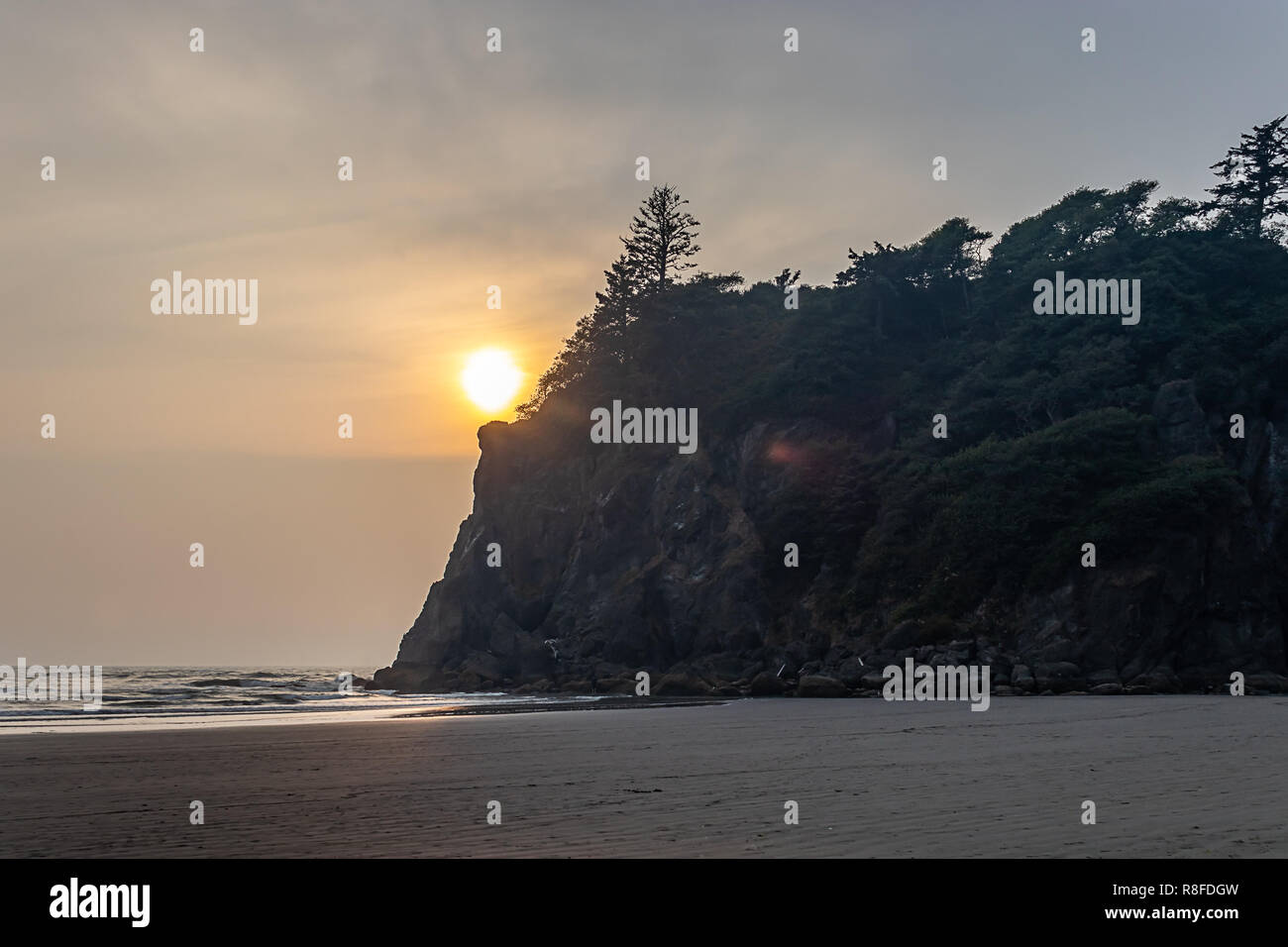 golden sun behind beach haze in washington state Stock Photo - Alamy