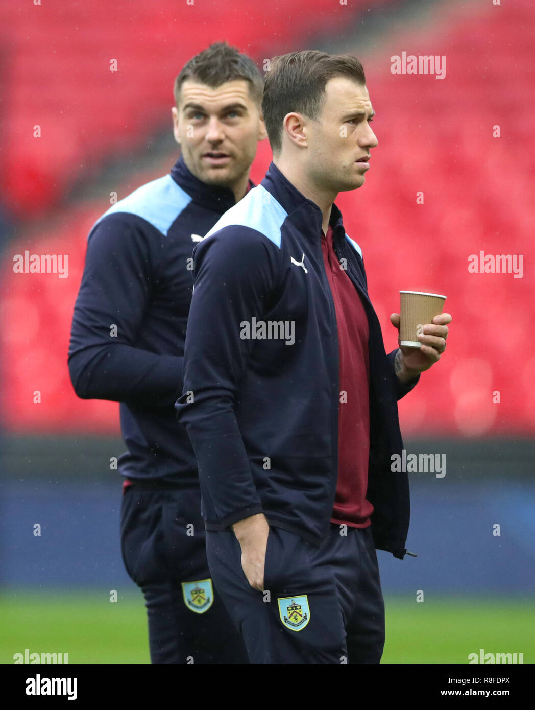 Burnley's Ashley Barnes (right) inspects the pitch ahead of the Premier ...
