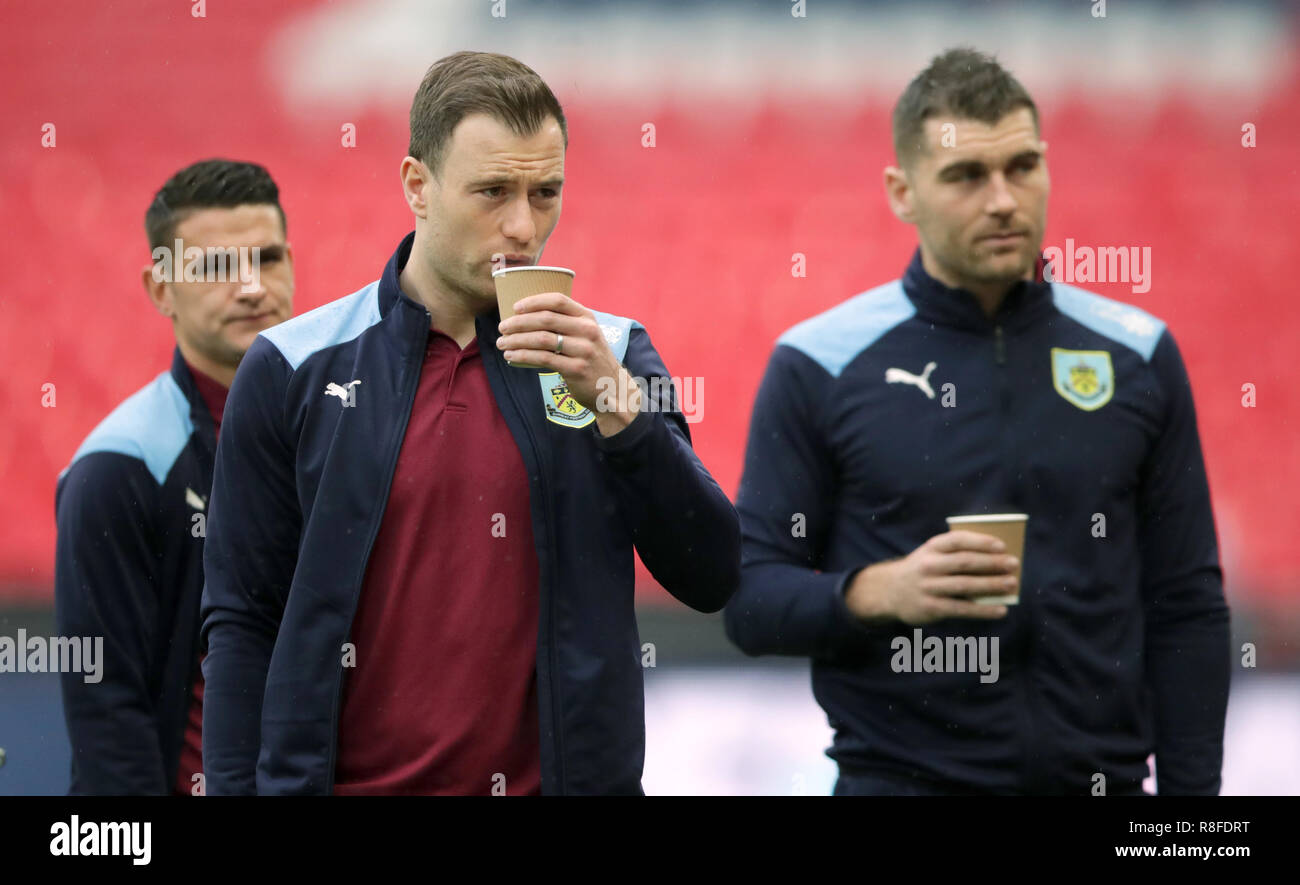 Burnley's Ashley Barnes (centre) inspects the pitch ahead of the ...