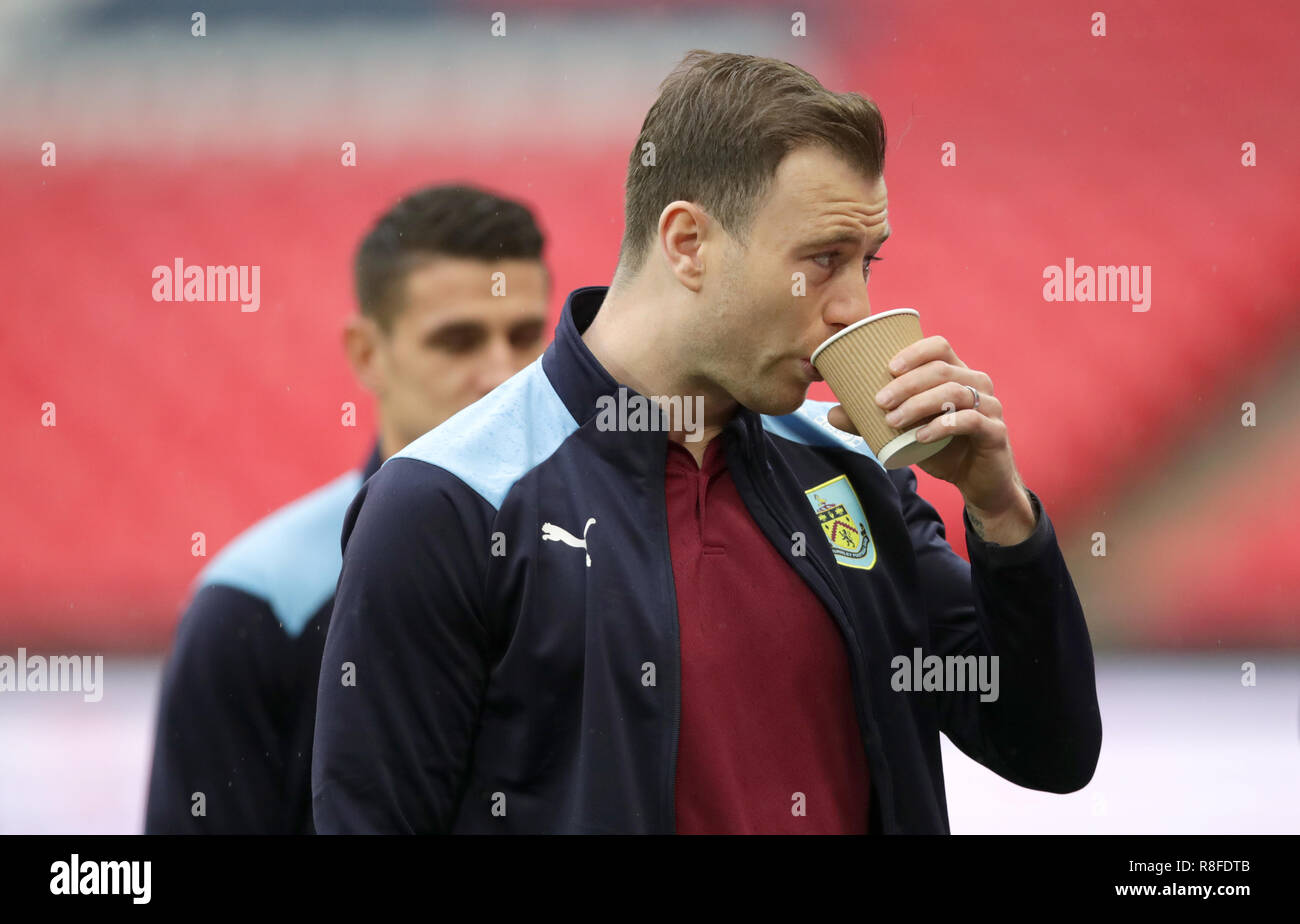 Burnley's Ashley Barnes inspects the pitch ahead of the Premier League ...