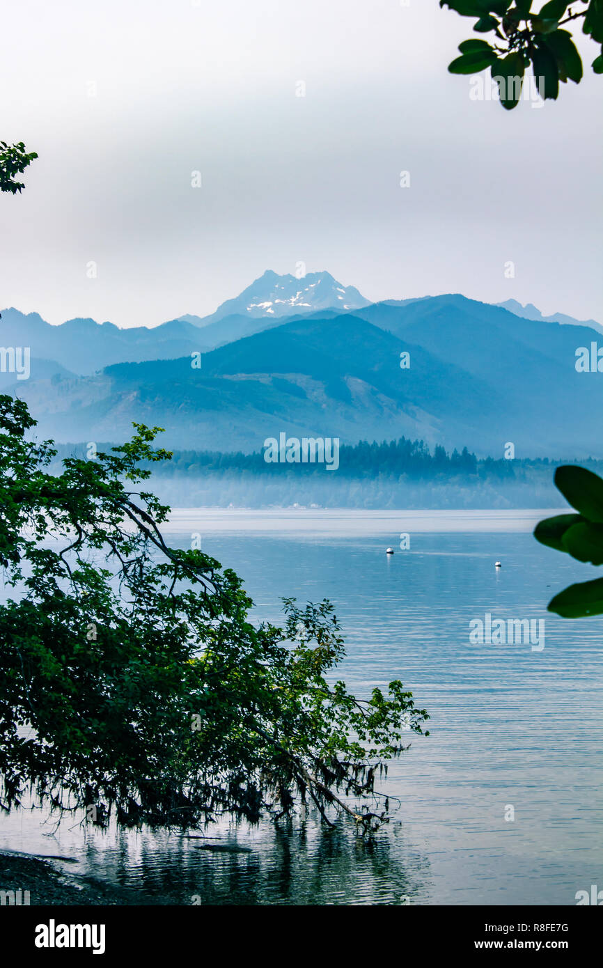puget sound waters with mountain range in background Stock Photo - Alamy