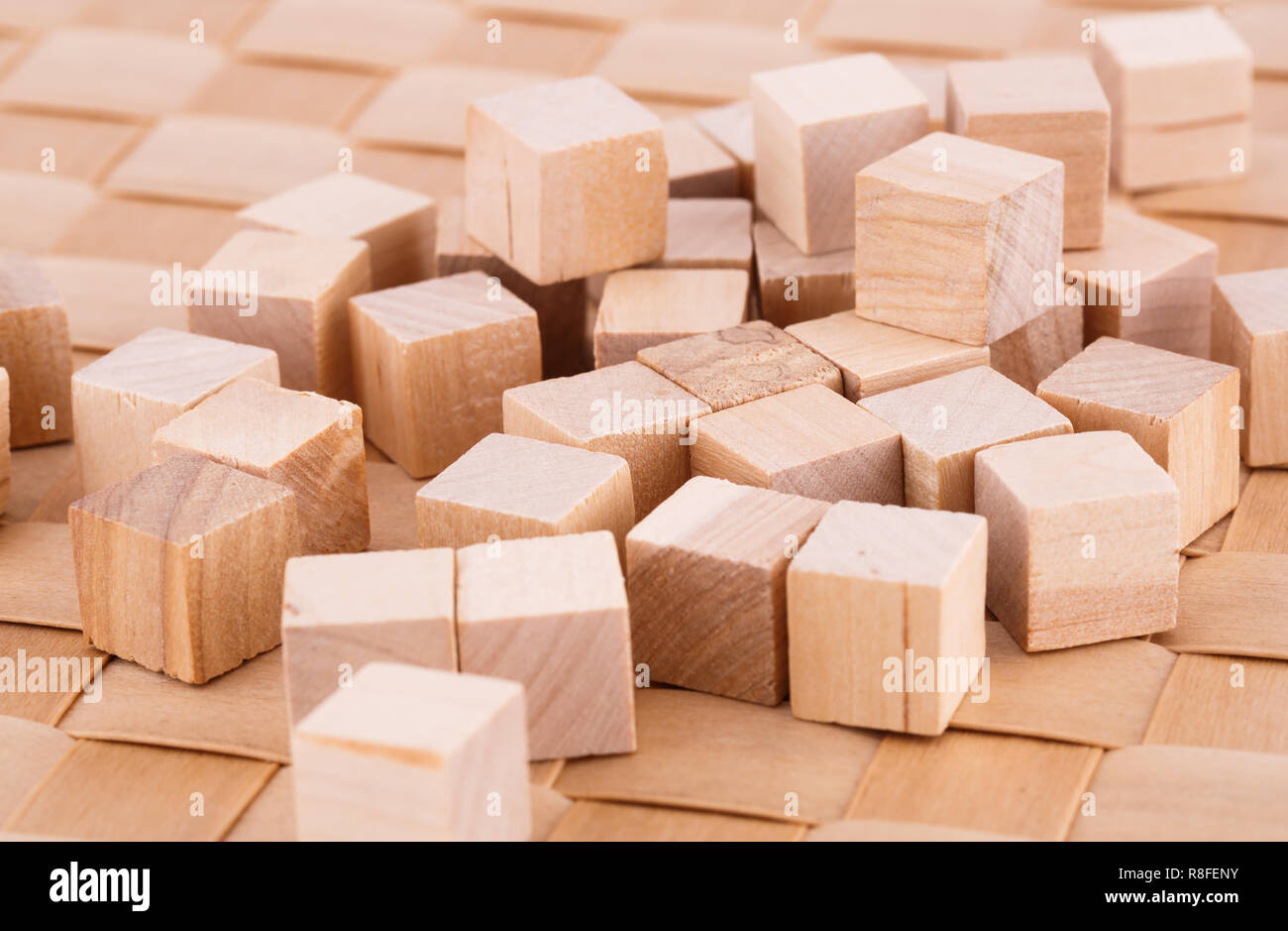 Wooden cubes on bamboo background Stock Photo - Alamy