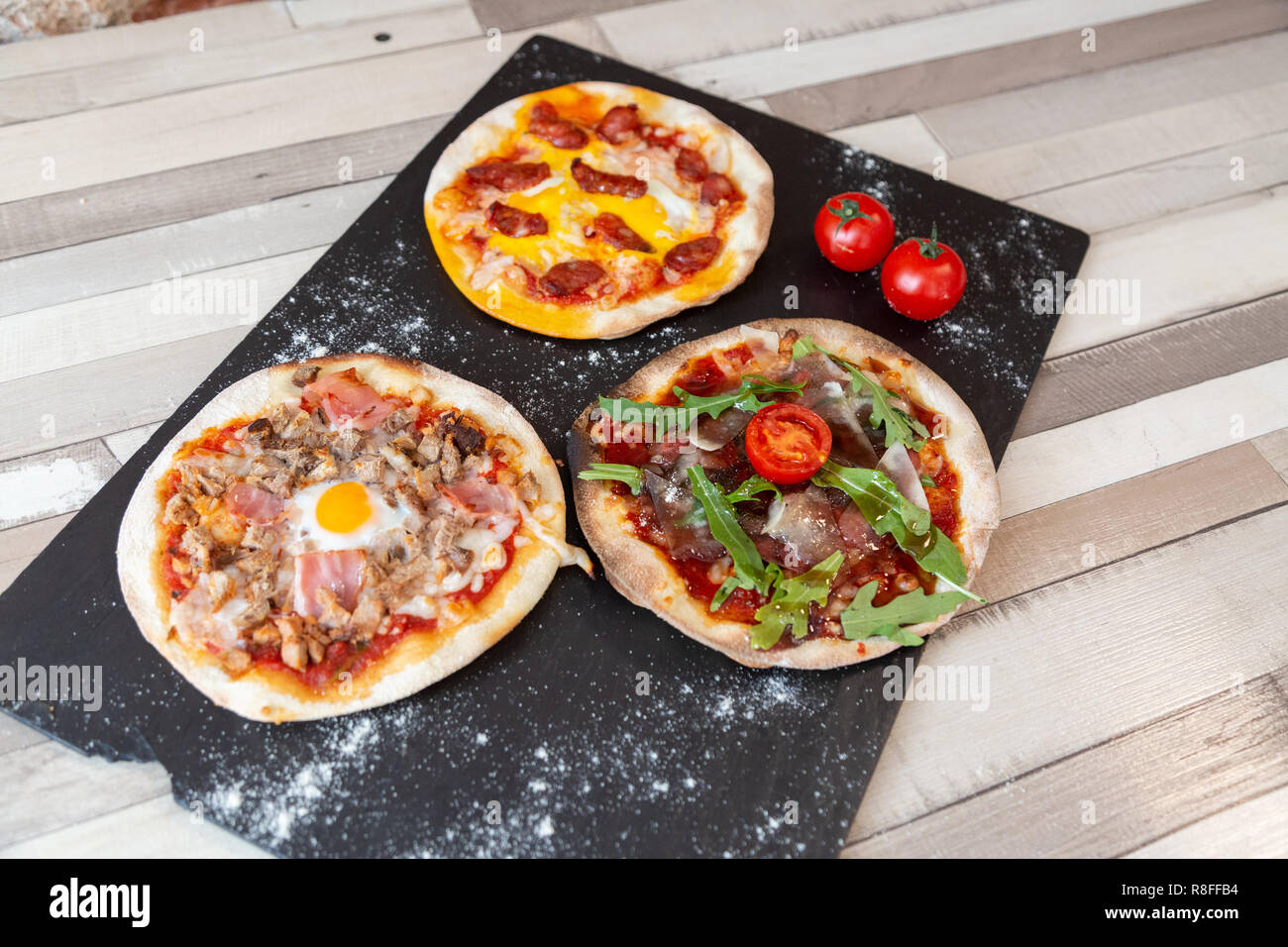 Two small pizzas different hi-res stock photography and images - Alamy
