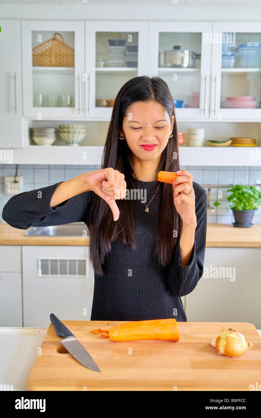 Beautiful woman posing - thumbs down, dislike and disgust Stock Photo ...