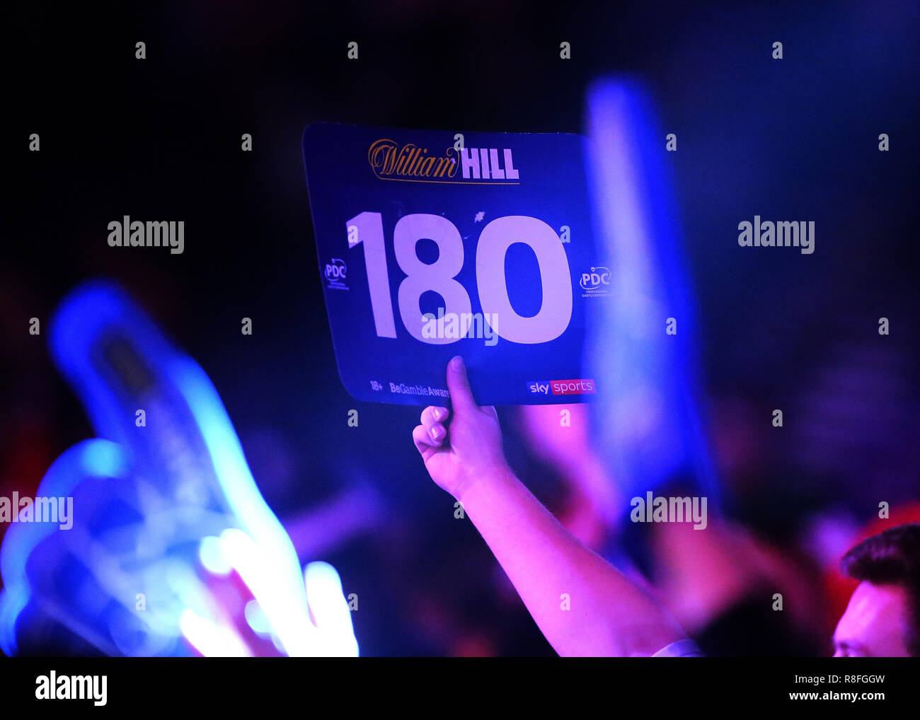 A 180 card is held up during day three of the William Hill World Darts ...
