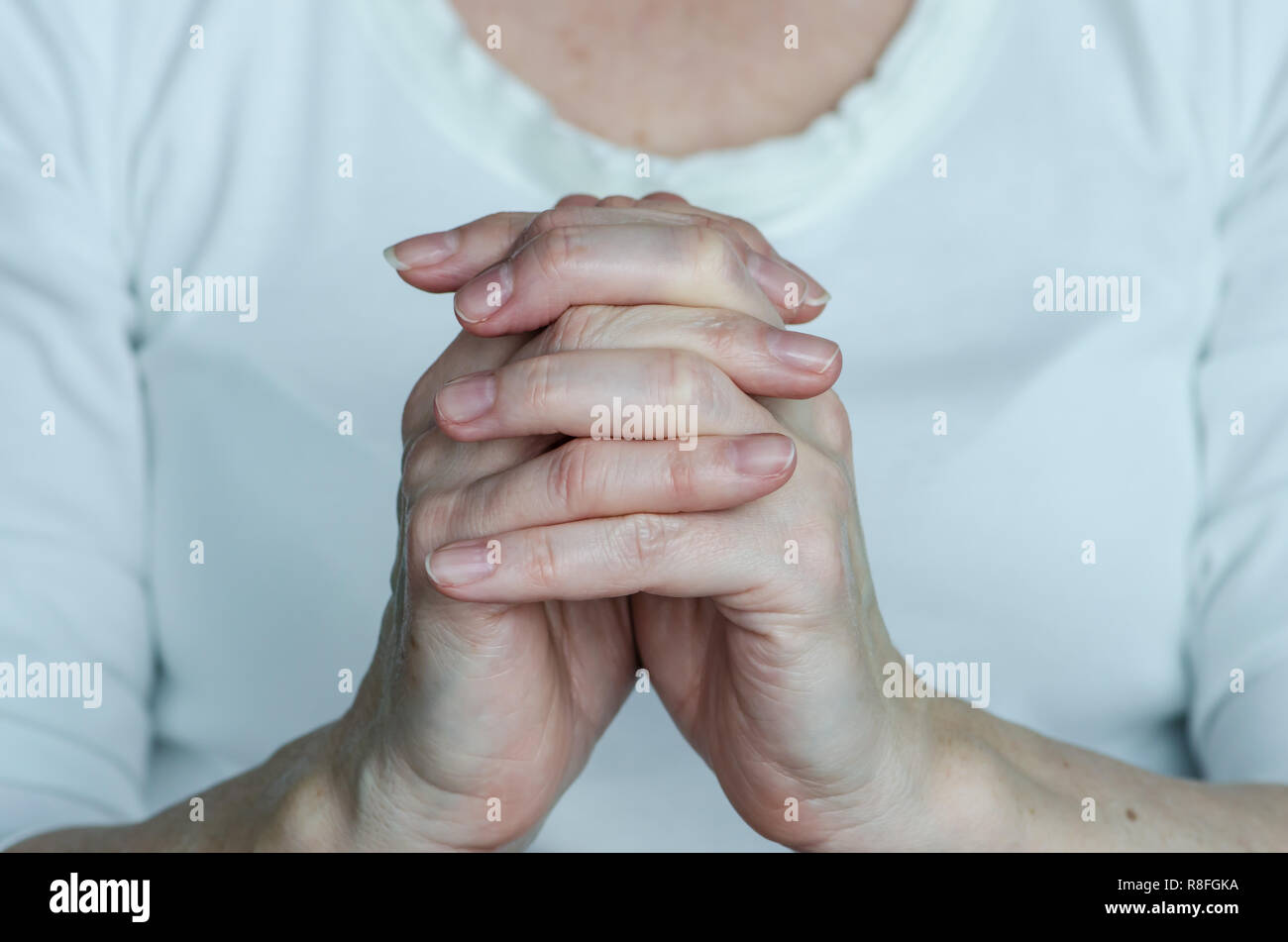 hands with pray gesture Stock Photo - Alamy