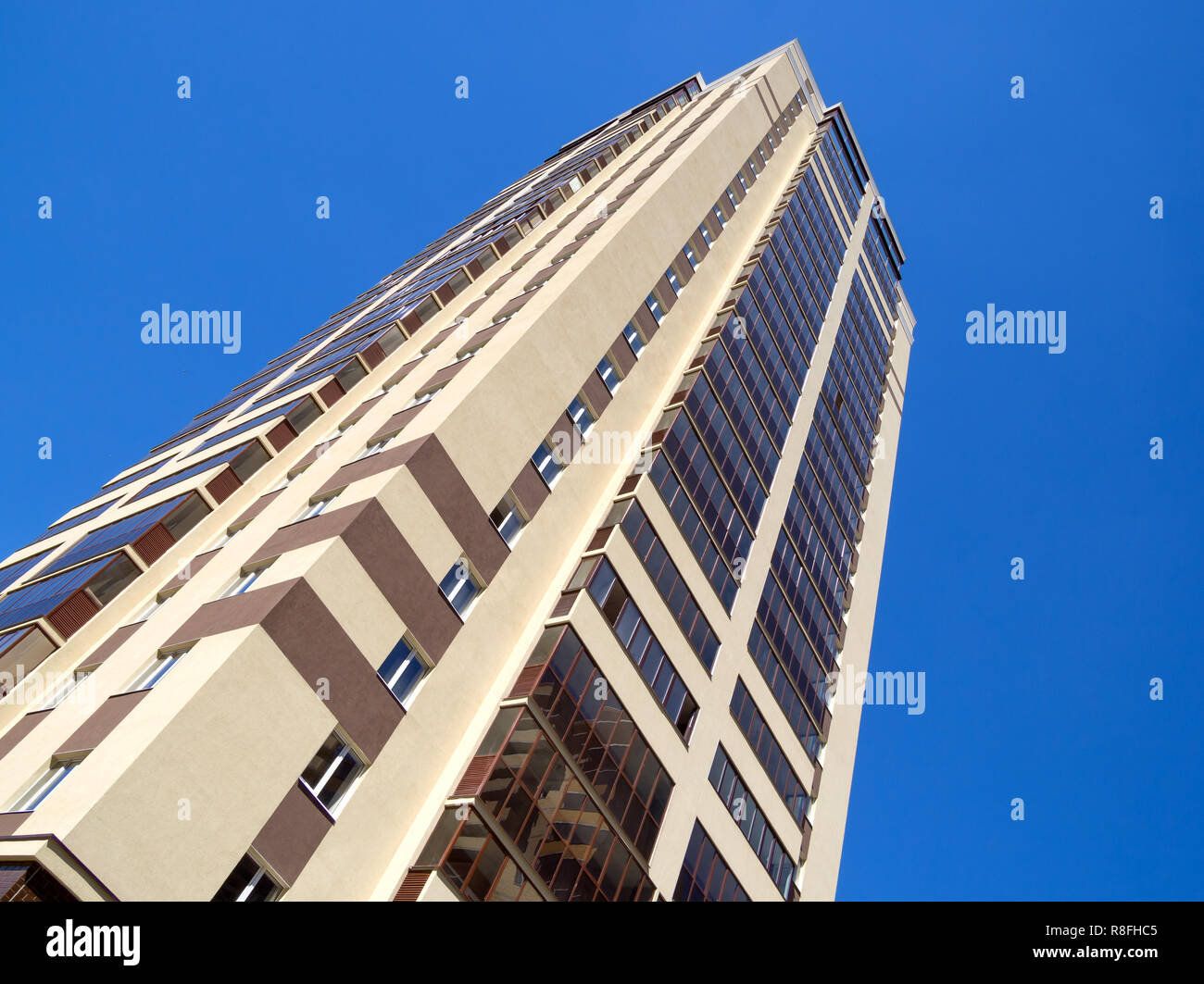 New high-rise building on the background of clear sky Stock Photo - Alamy