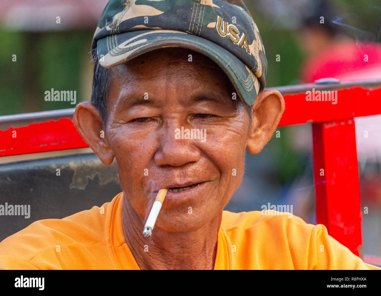 Asian man smoking cigar hi-res stock photography and images - Alamy