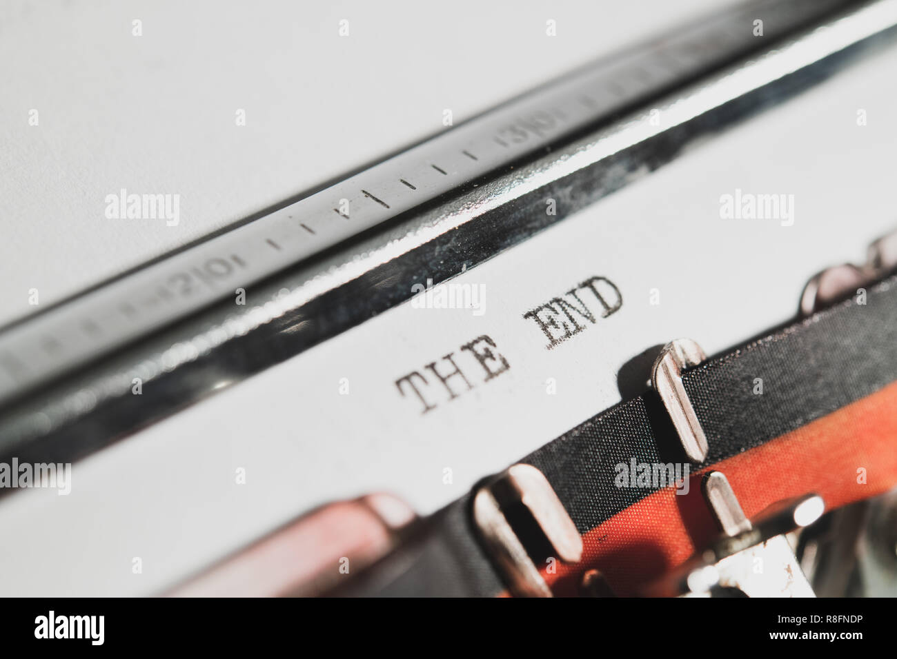 "The End" text on white paper classic movie script ending close up ...