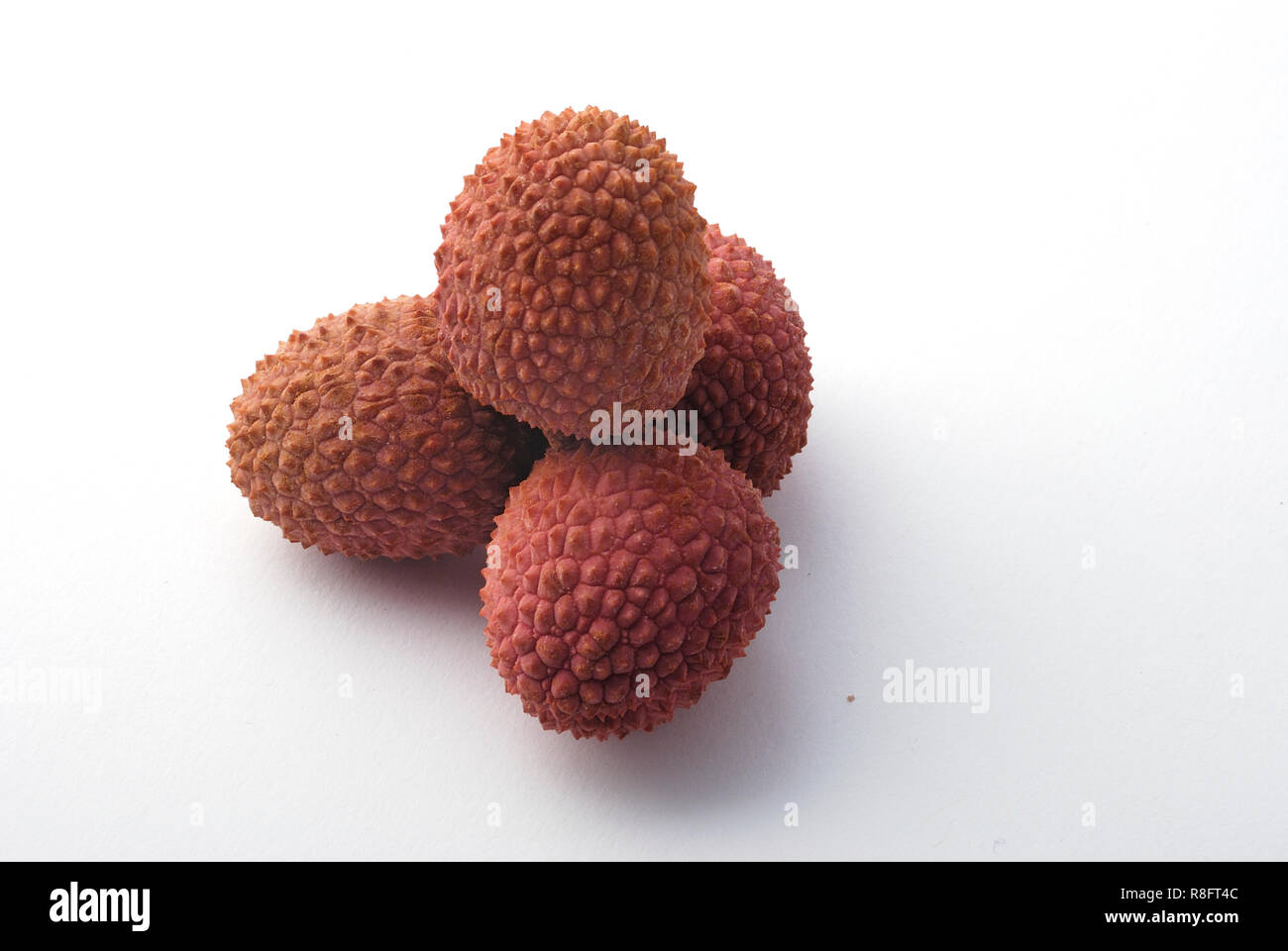 litchis on a white background Stock Photo - Alamy