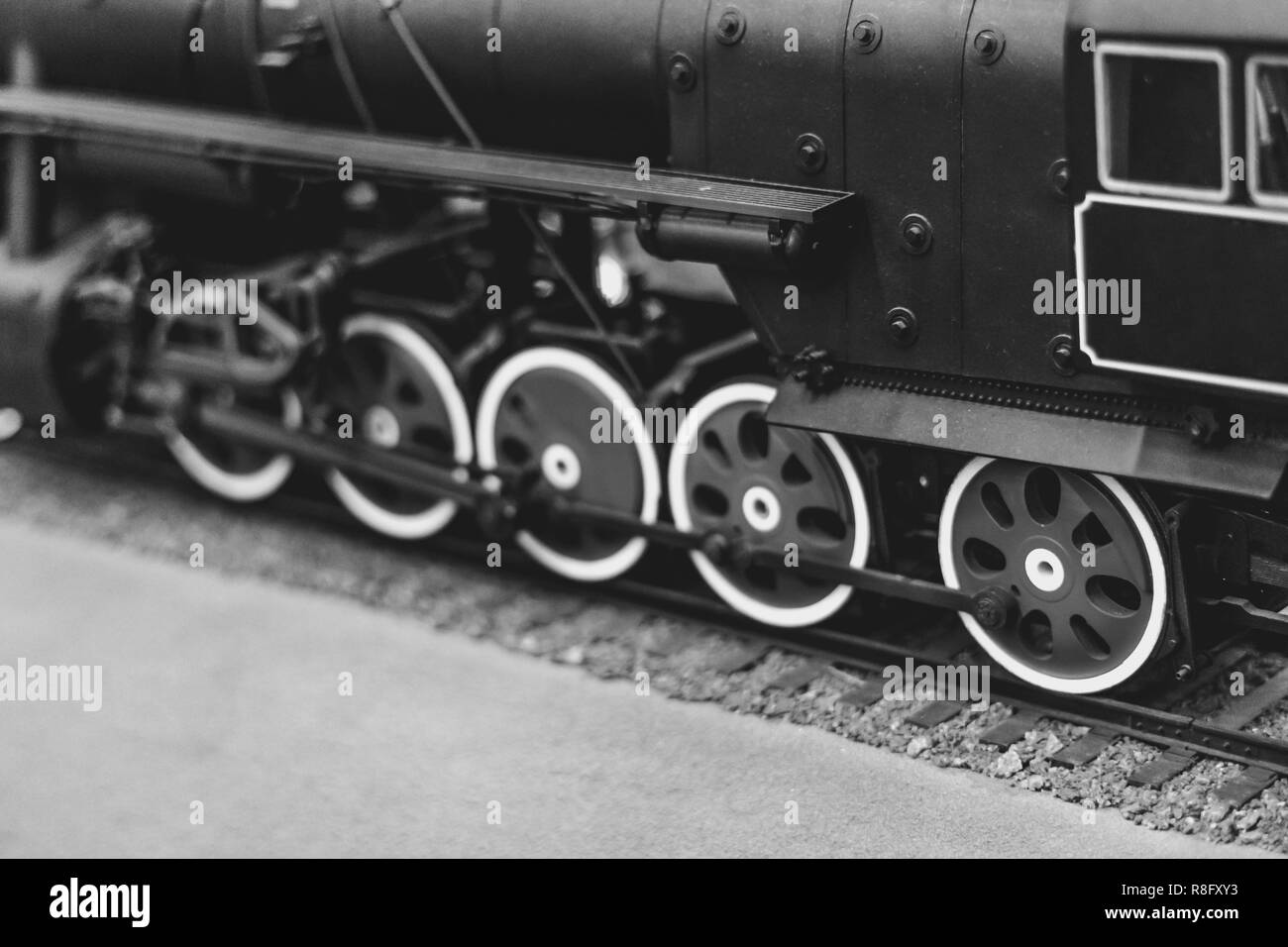 Black model Locomotive on track layout with headlamp Stock Photo - Alamy