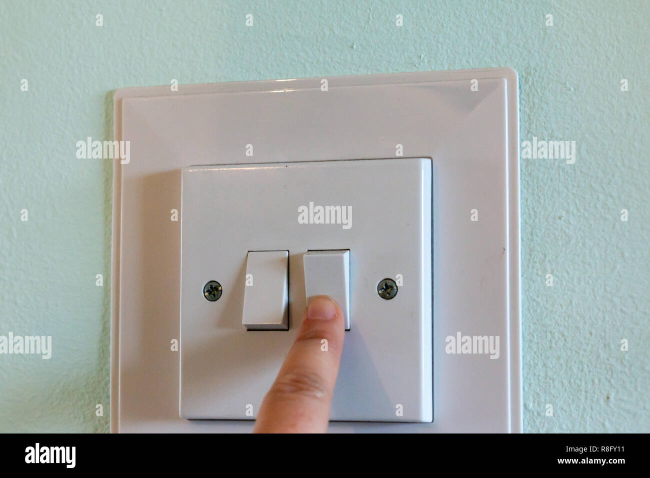 Light switch finger hi-res stock photography and images - Alamy