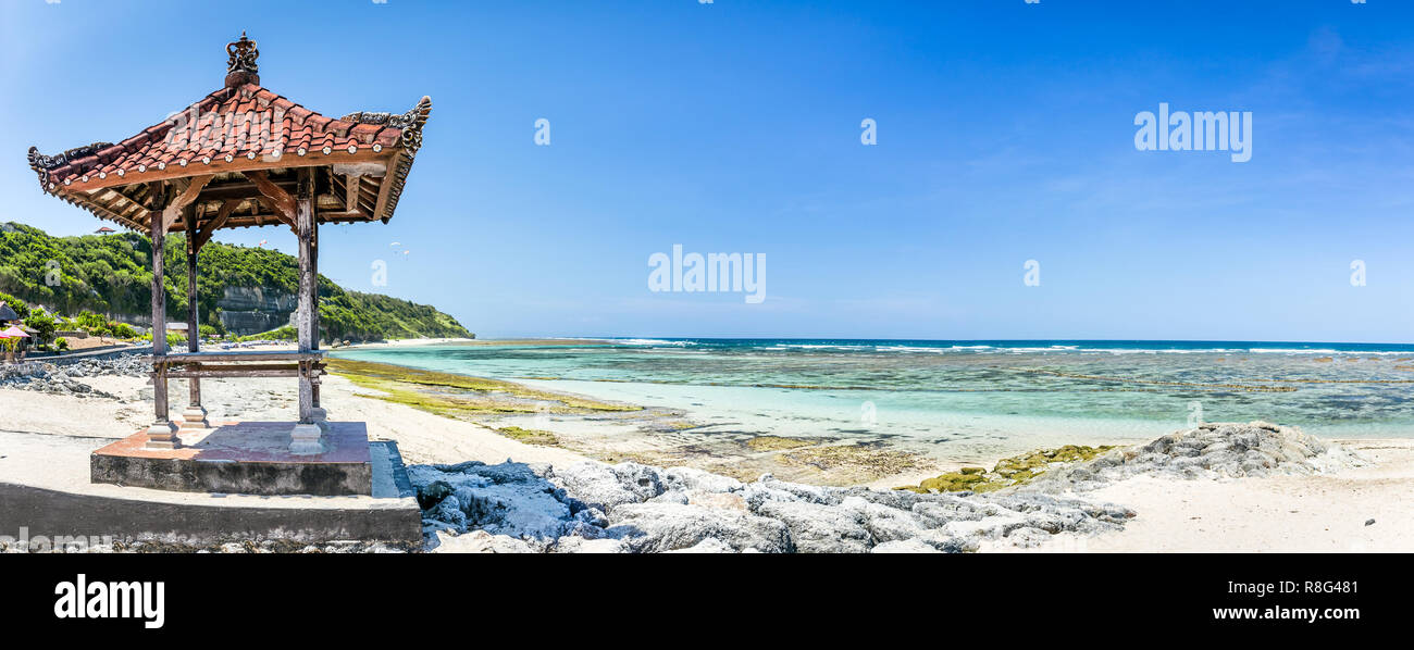 Traditional hut on balinese beach in Indonesia Stock Photo - Alamy