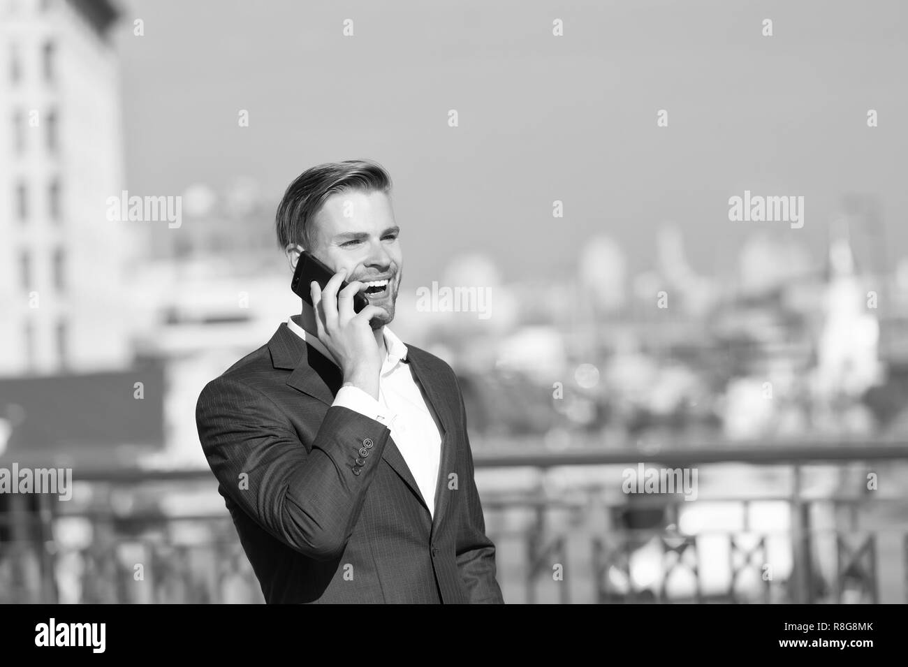 Businessman happy smiling use smartphone communication, skyline ...