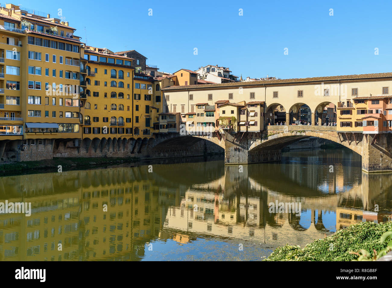 Ponte Vecchio Bridge over river Arno at sunny day in Florence. Italy ...