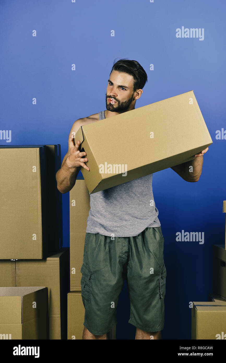 Macho with beard and curious face. Delivery and moving in concept. Guy ...