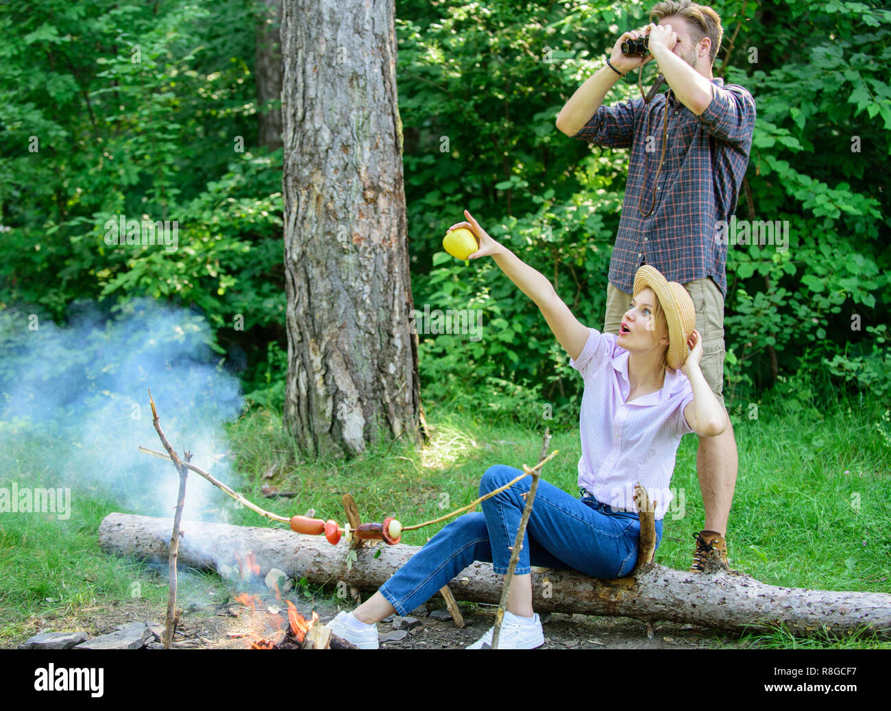 Couple enjoy hike in forest observing nature. Couple ornithologists ...