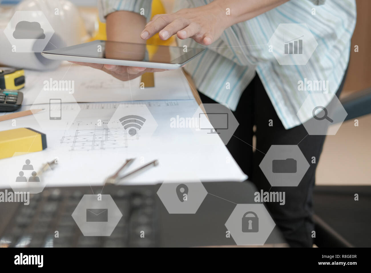 architect using tablet. engineer working on house blueprint of real ...