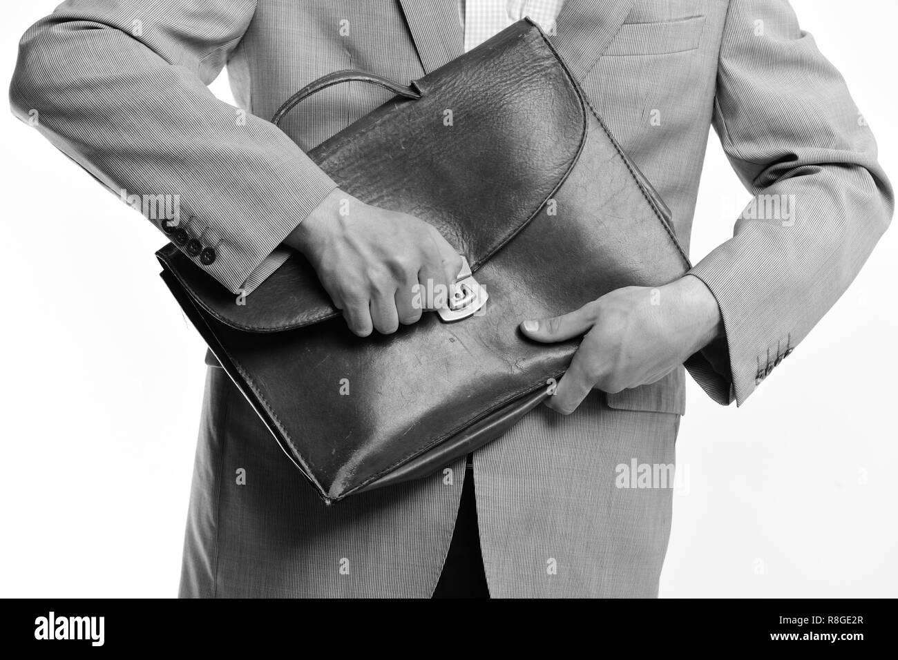 Male hands open brown leather bag. Academic style and business concept ...